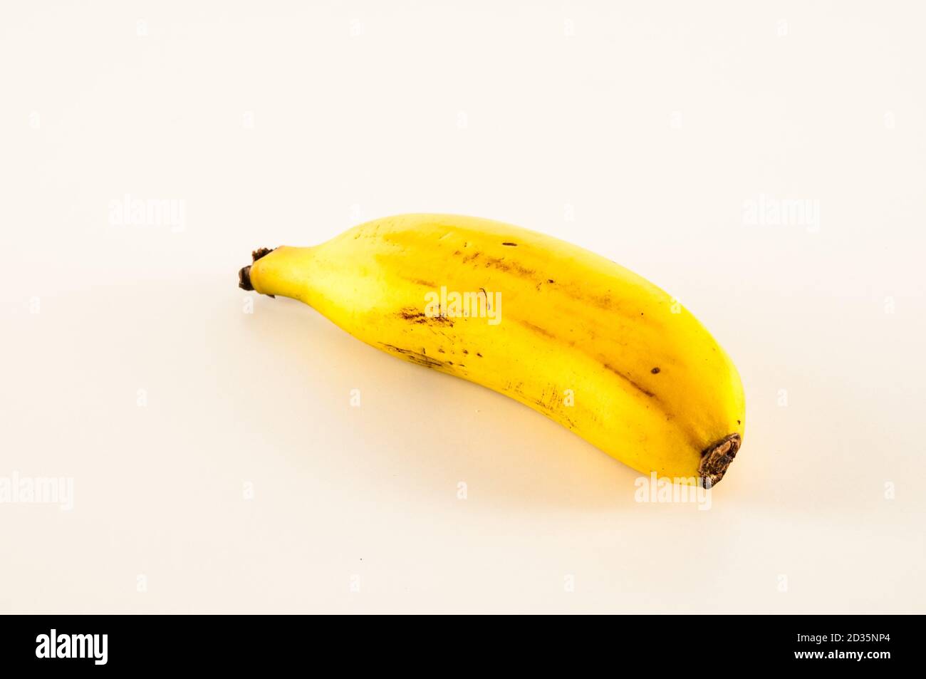 One banana on white background Stock Photo - Alamy