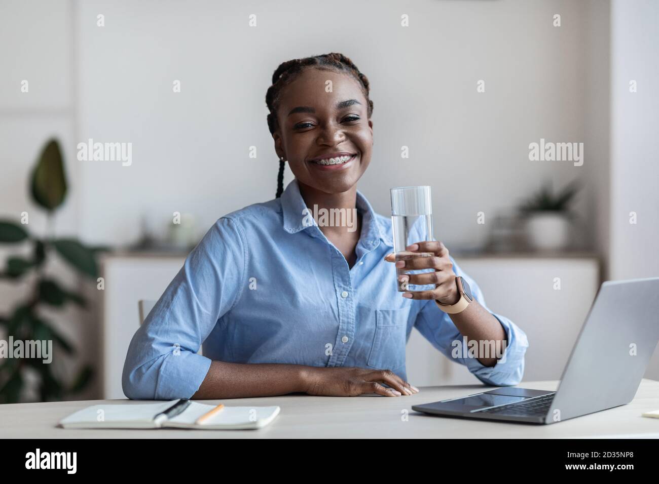 Hydration At Work. Happy Black Female Office Worker Holding Glass Of ...