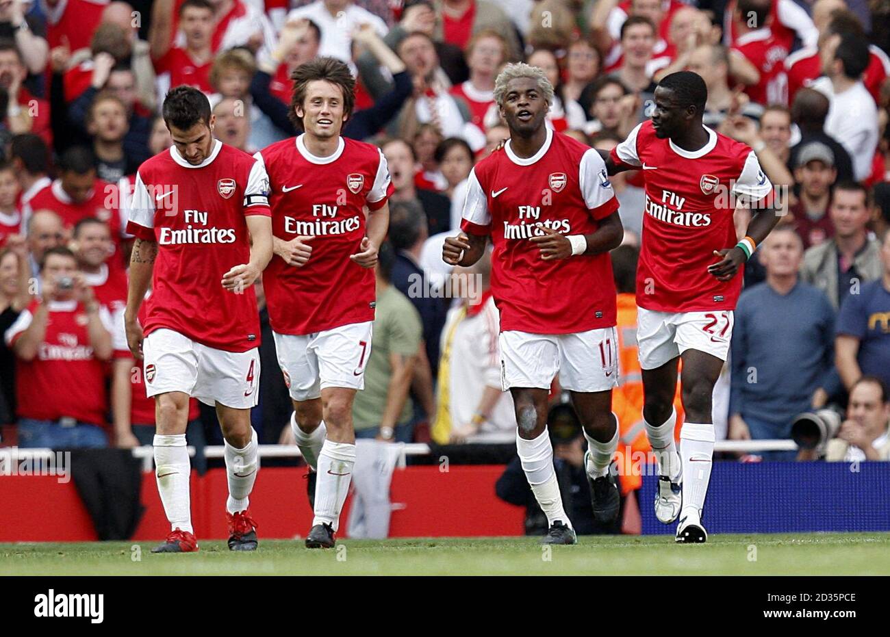 Arsenal's Alex Song (second right) celebrates scoring his side's third ...