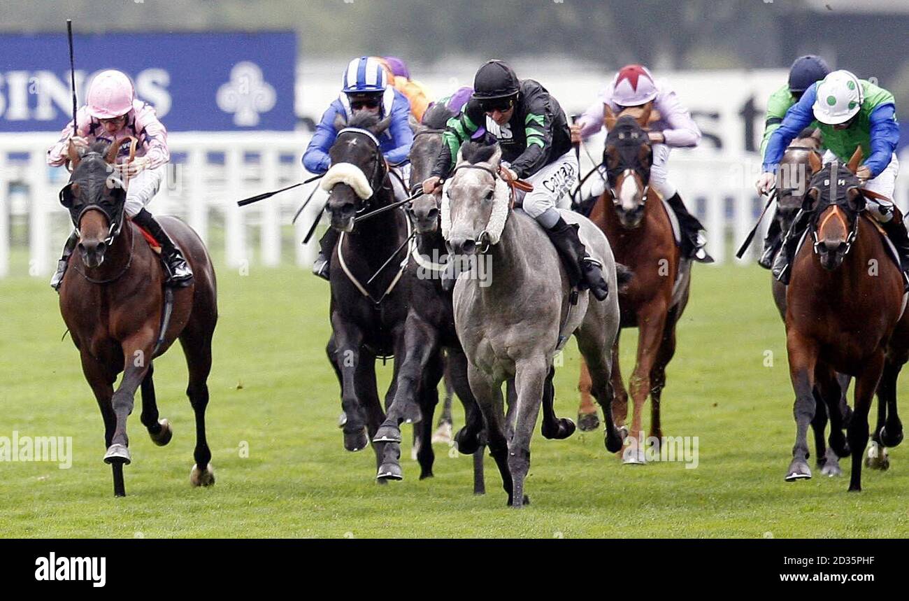 Capaill Liath and jockey Michael Hills (centre) go on win the Abf ...
