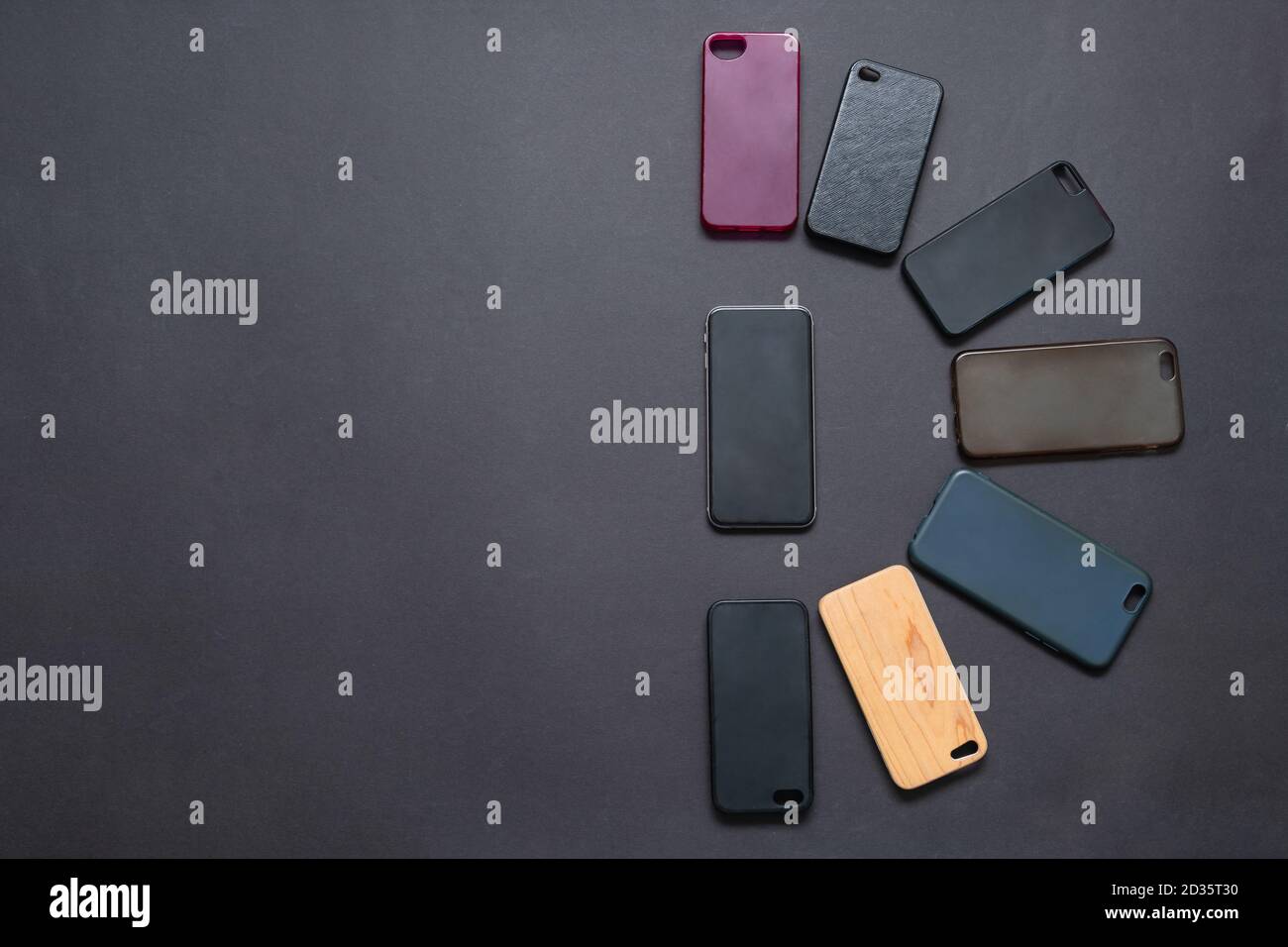 Pile of multicolored plastic back covers for mobile phone on black ...