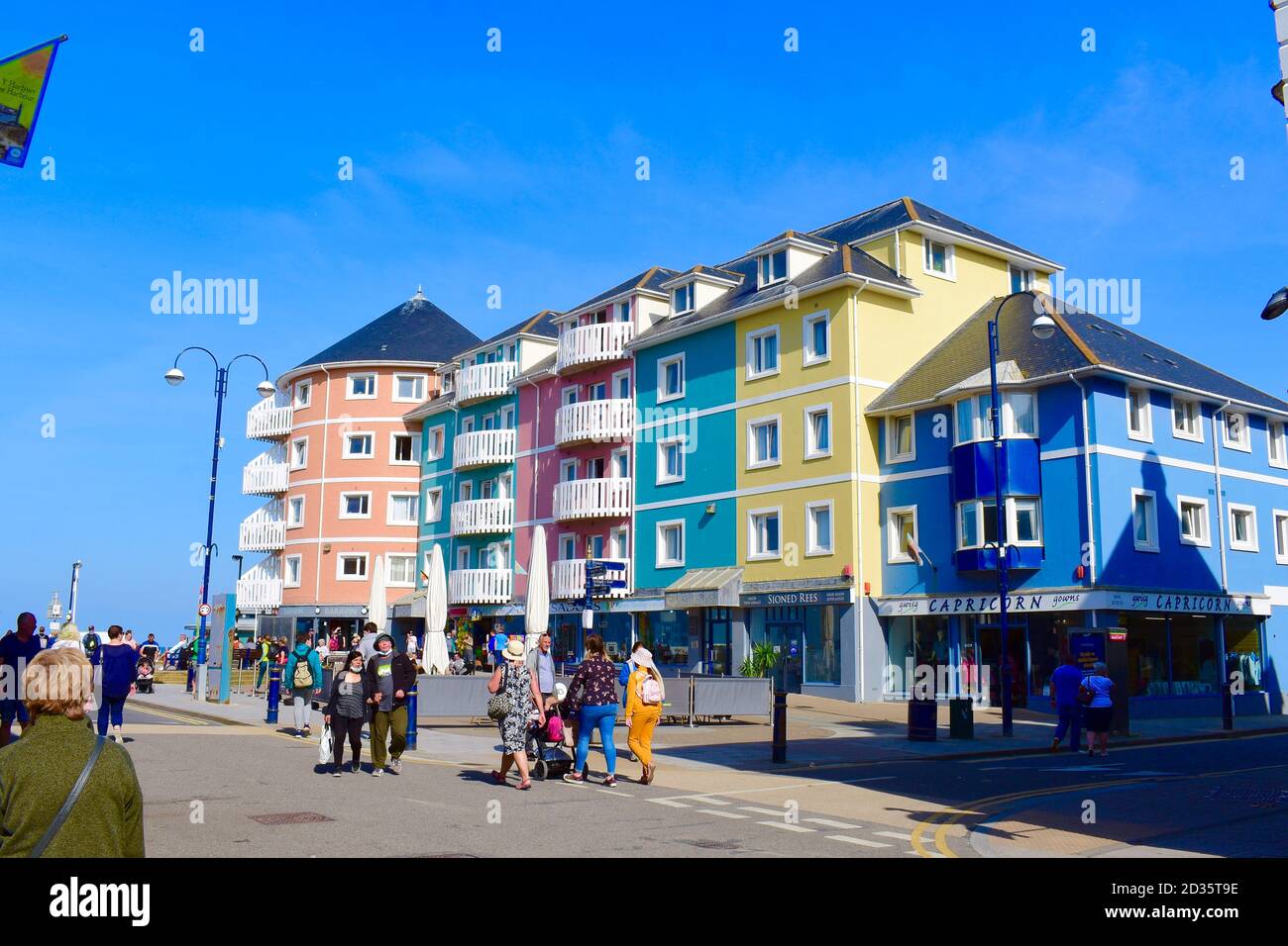 A colourful mix of modern buildings providing flats / apartments above ...