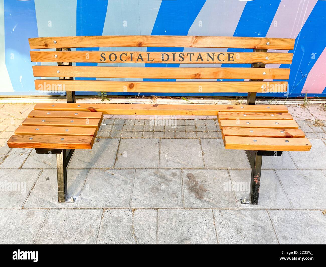 Wooden bench built to keep social distance due to the corona virus ...