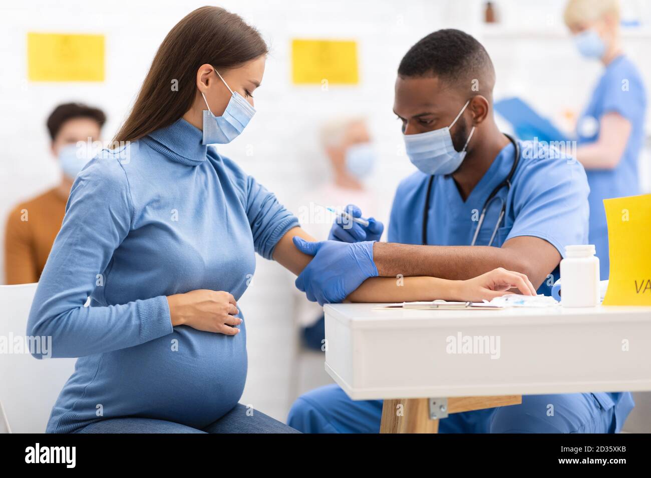 Doctor giving woman injection hi-res stock photography and images - Alamy