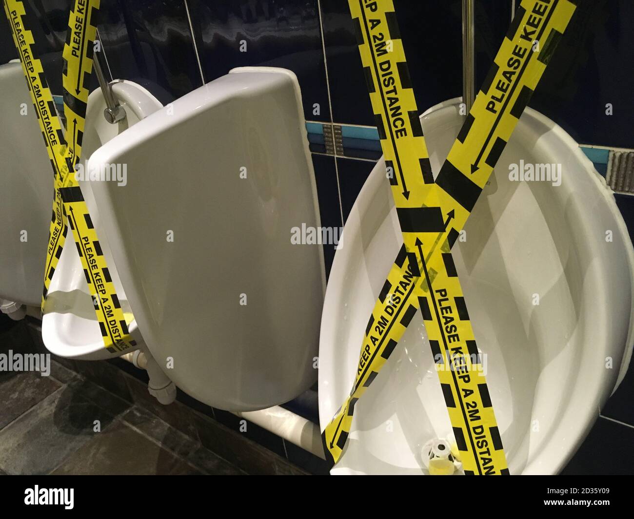 Bathroom facilities - including toilets, urinals and sinks, taped off ...