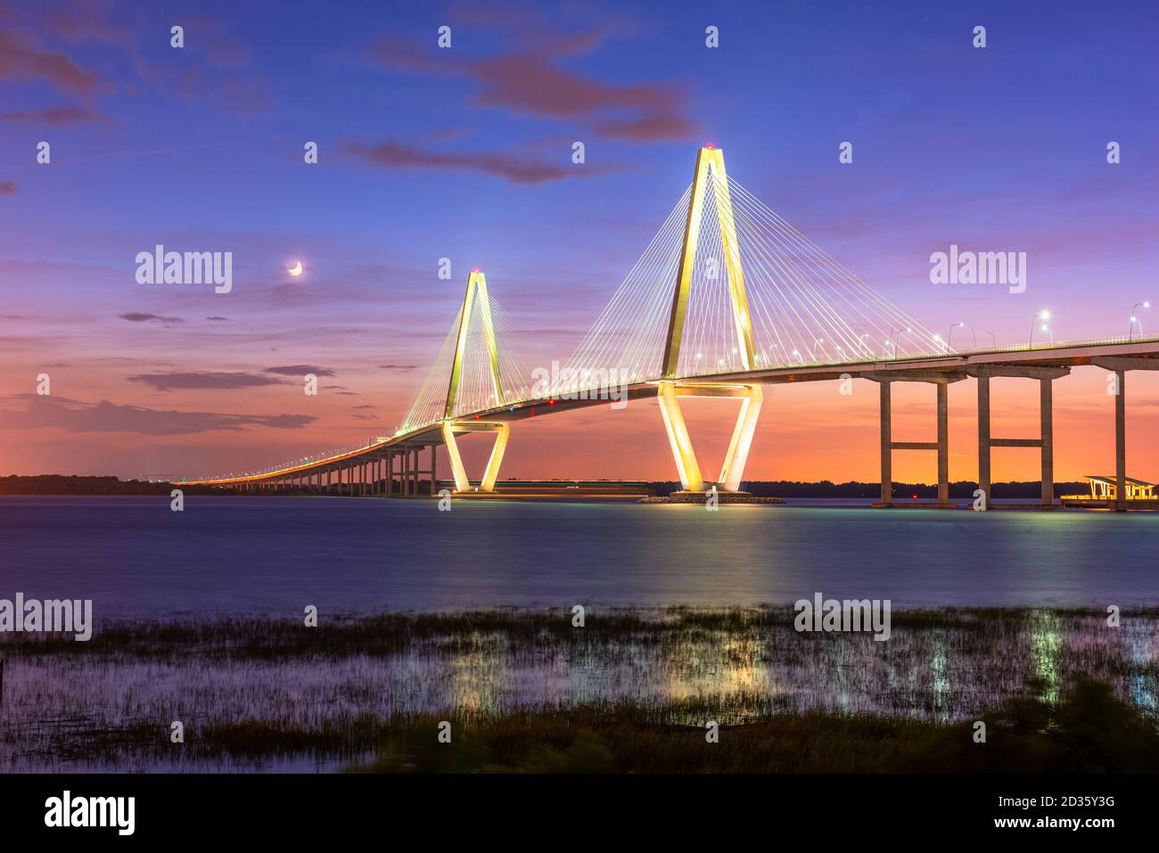 Charleston, South Carolina, USA at Arthur Ravenel Jr. Bridge at dusk ...