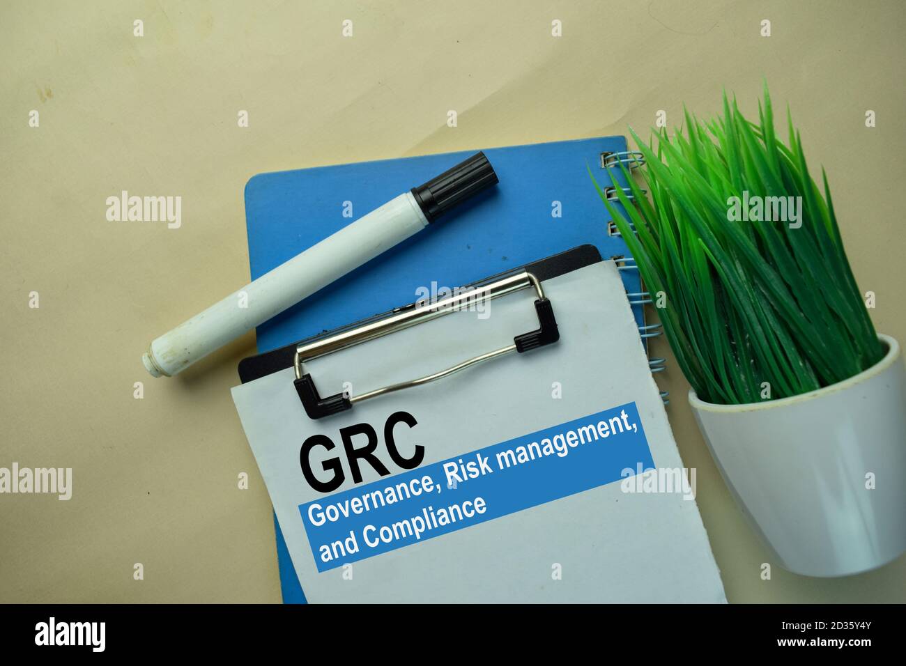 GRC - Governance, Risk Management, and Compliance write on a paperwork ...