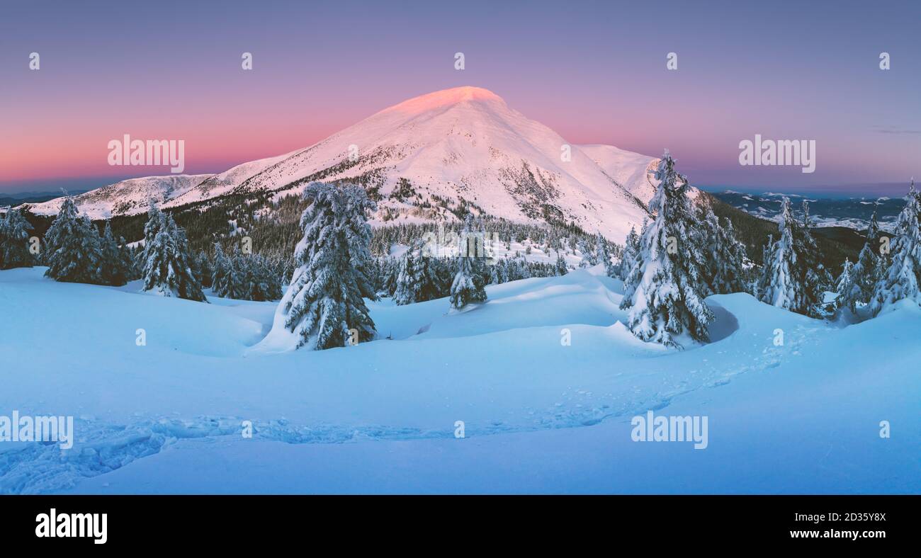 Fantastic orange winter landscape in snowy mountains glowing by ...