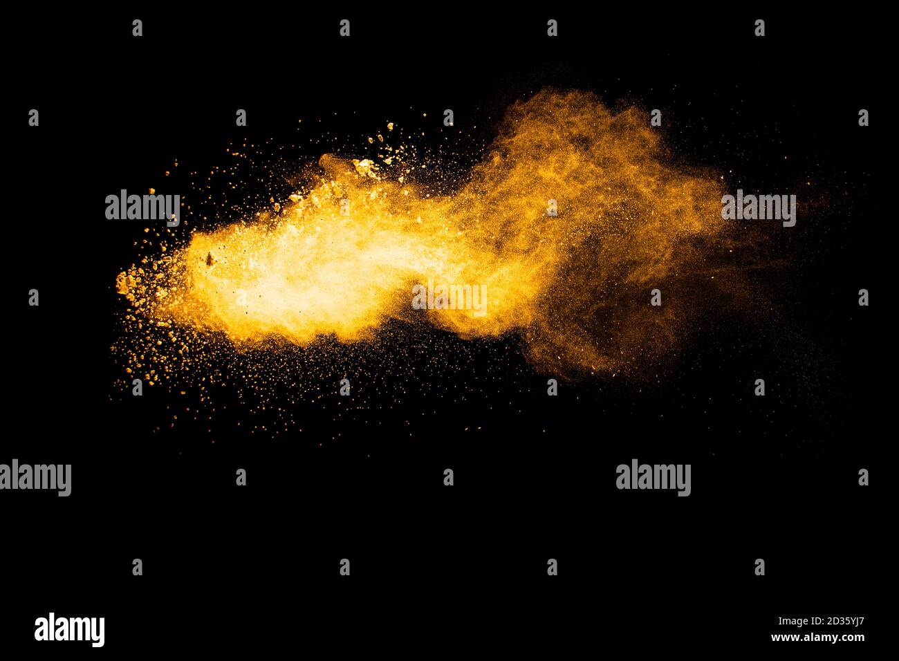 Orange color powder explosion on black background Stock Photo - Alamy