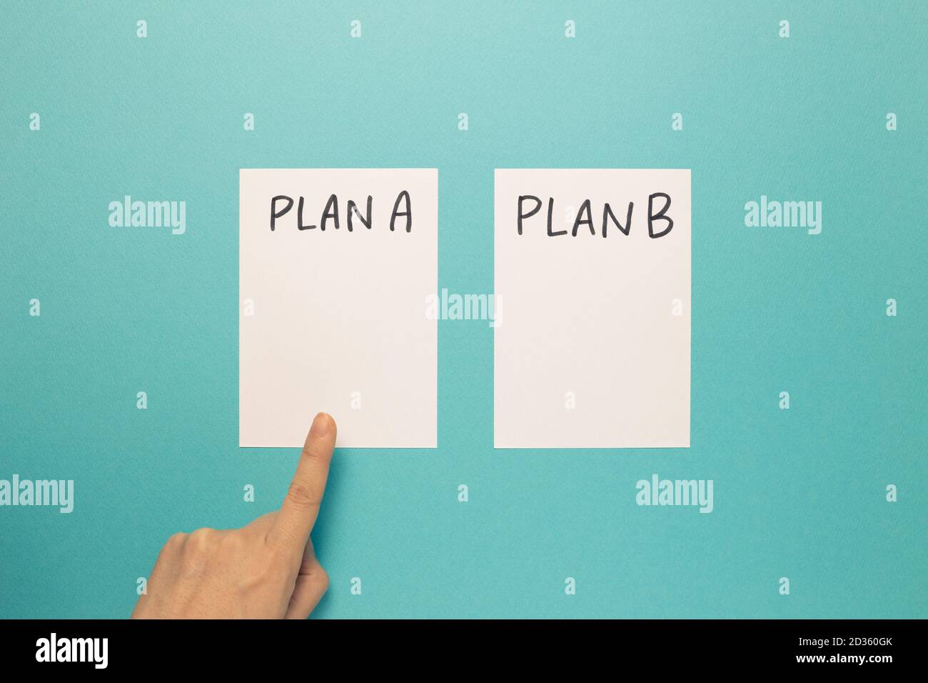 Choose Plan A with finger on blue background. Business plan, choice ...