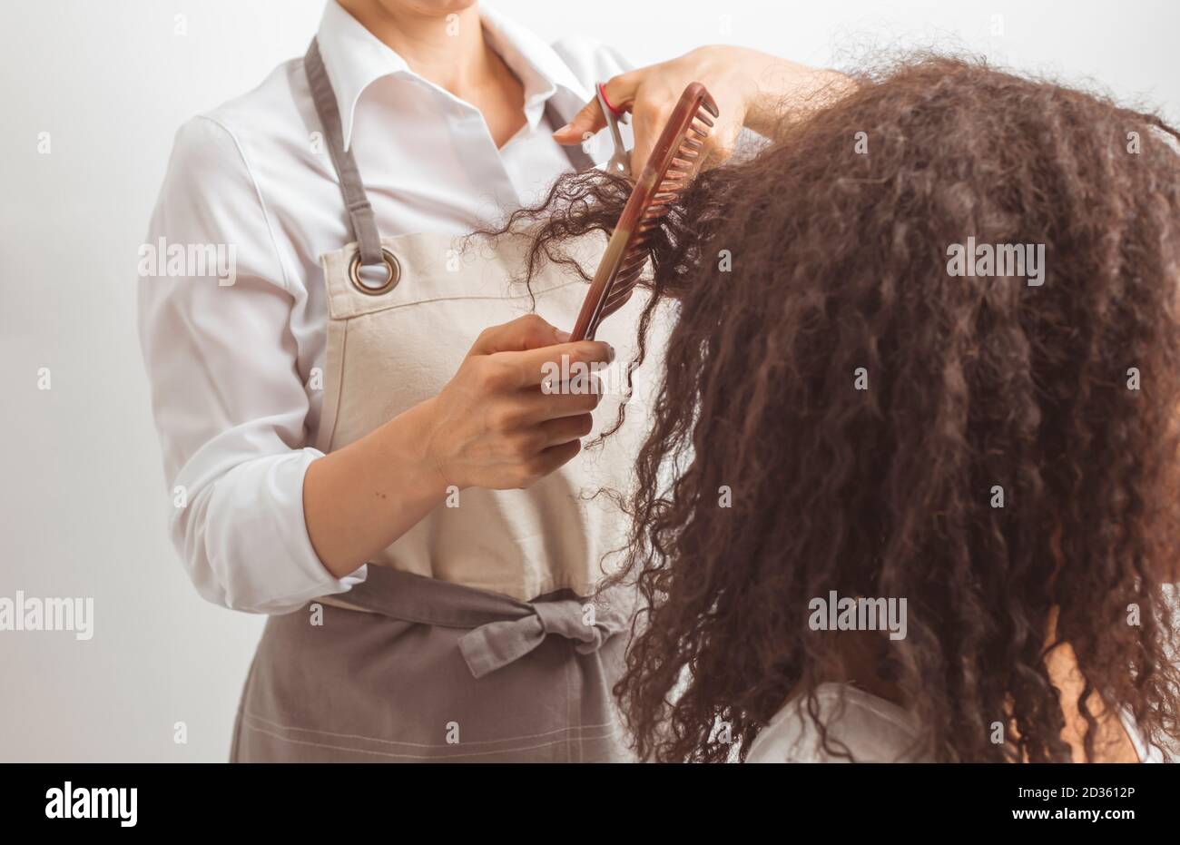 Cutting afro hair in a barbershop Stock Photo - Alamy