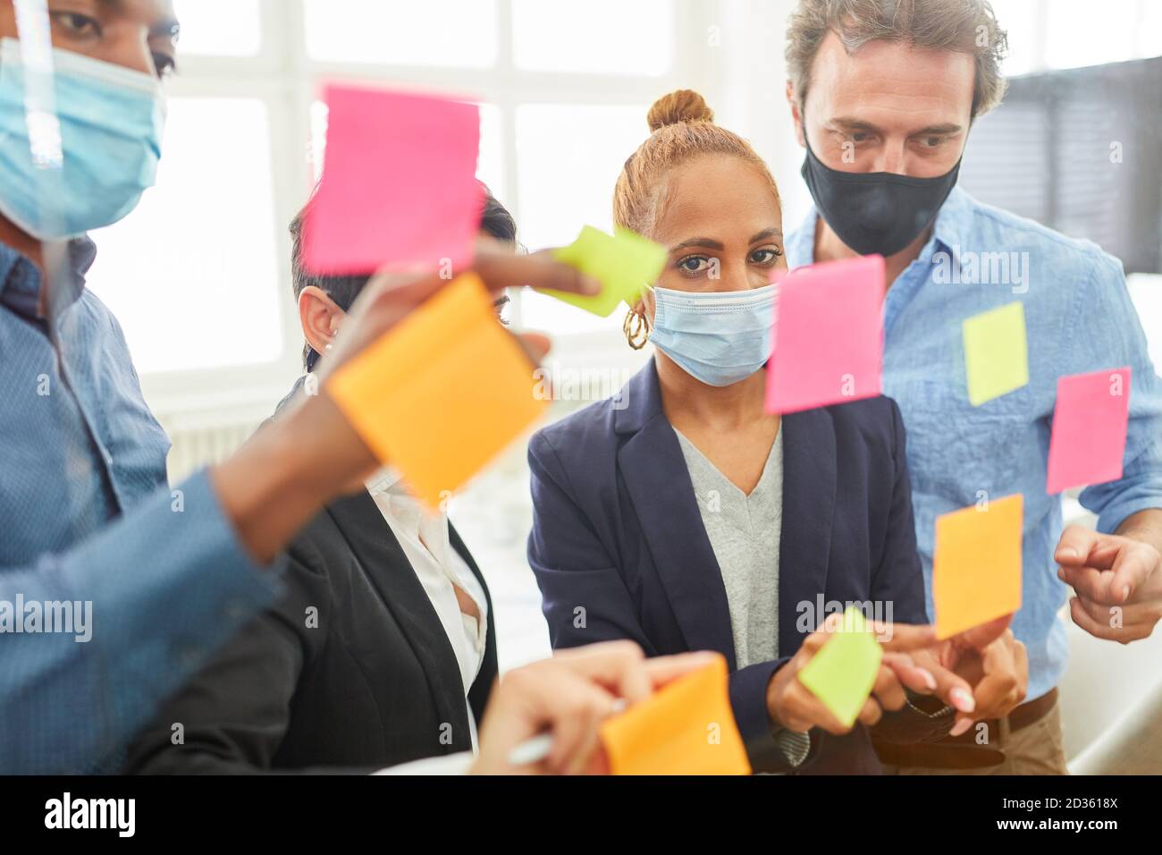 Start-up business people with sticky notes in creative brainstorming ...