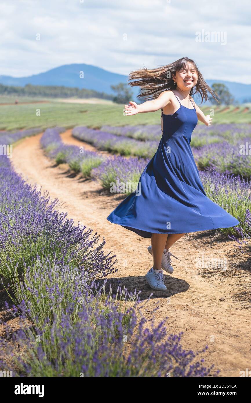 Beautiful happy young girl dance and sway with arms hands outstretch at ...