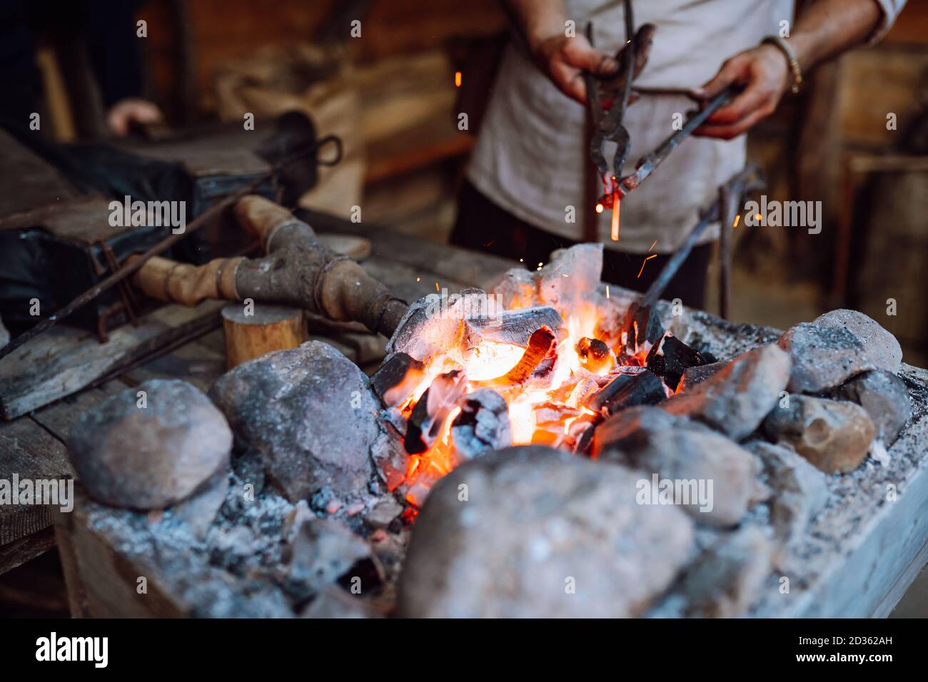 Fire crackling in blacksmith workshop of forging metal. Anonymouse ...