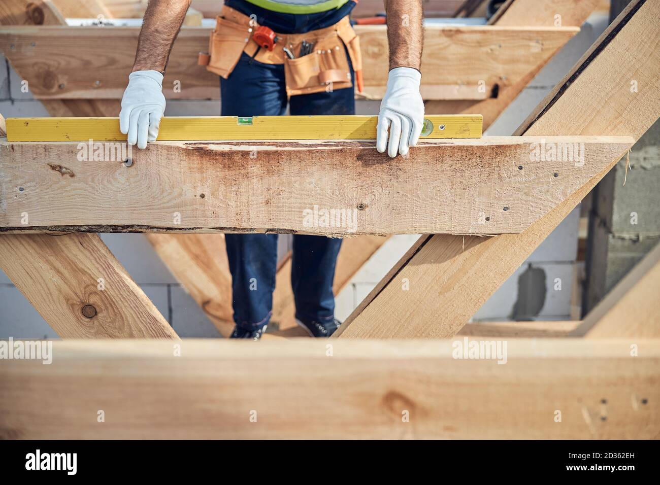 Construction site worker in gloves using a level spirit ruler Stock ...