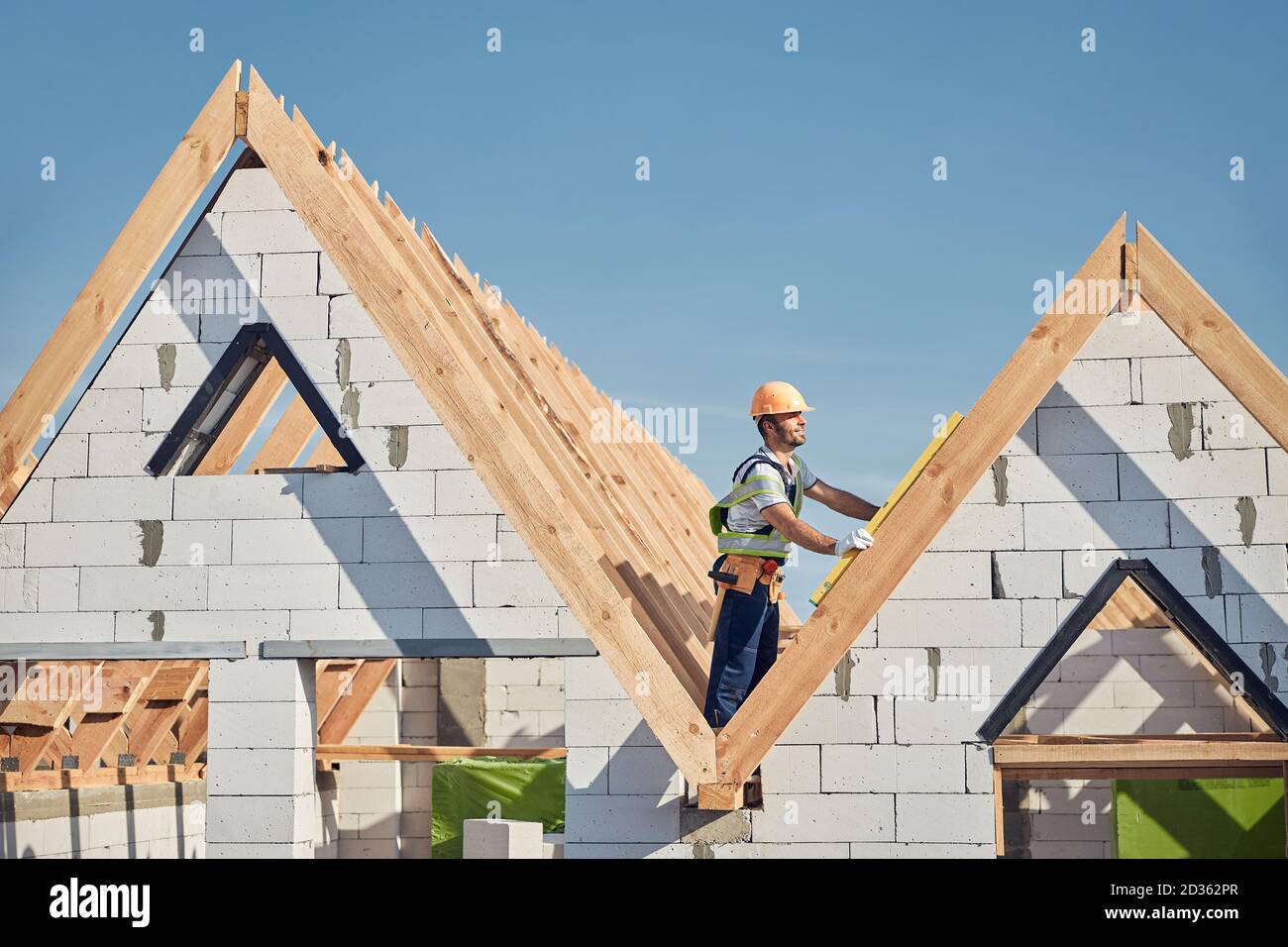 Professional construction worker standing on top of a building Stock ...