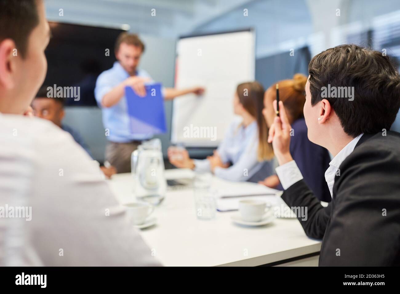 Start-up business team at the conference table during a training or ...