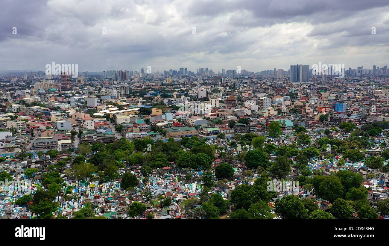 Manila North Cemetery on the background of skyscrapers and modern ...