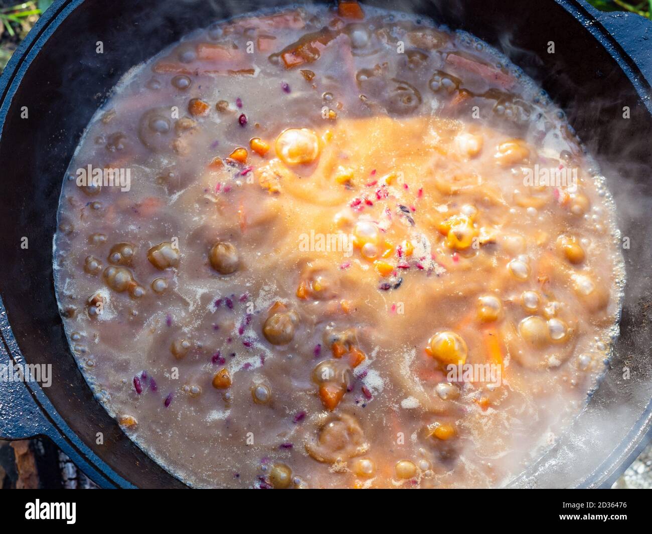 top view of boiling pottage in iron cauldron outdoors Stock Photo - Alamy