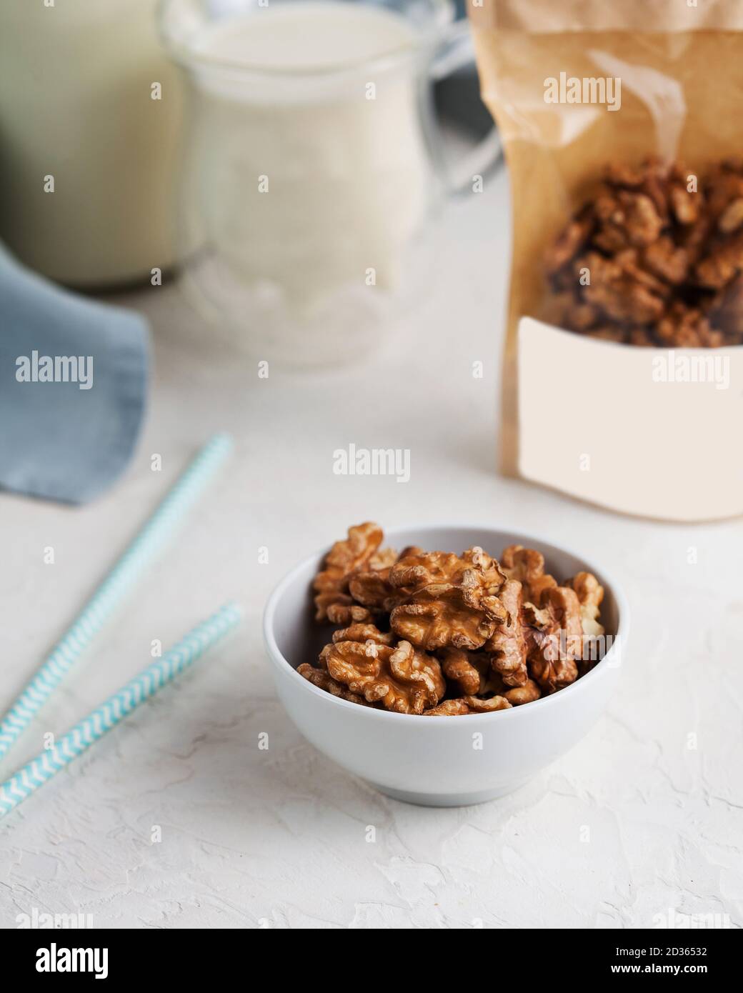 A handful of walnuts in close-up, a package of nuts with space for logo ...