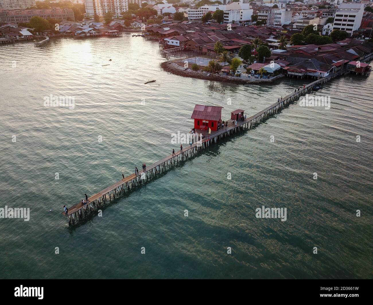 Georgetown, Penang/Malaysia - Feb 28 2020: Aerial view Tan Jetty with red temple during sunset ...