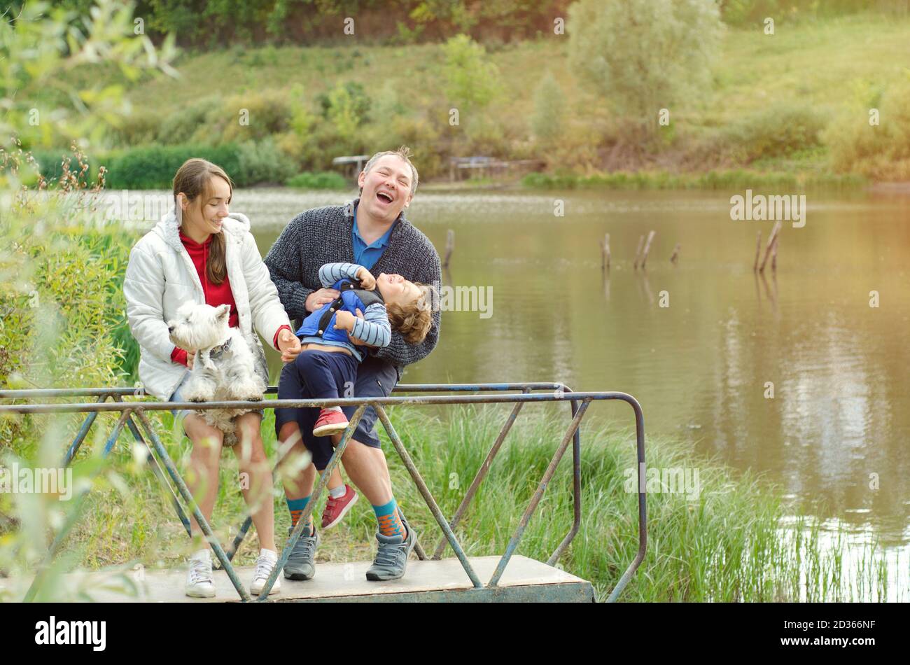 happy family enjoying weekend outdoors Stock Photo - Alamy