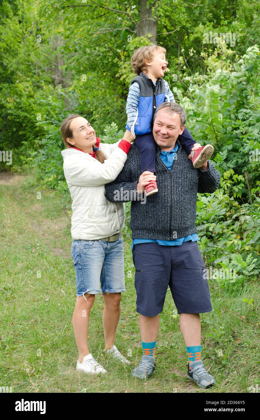 happy family enjoying weekend outdoors Stock Photo - Alamy