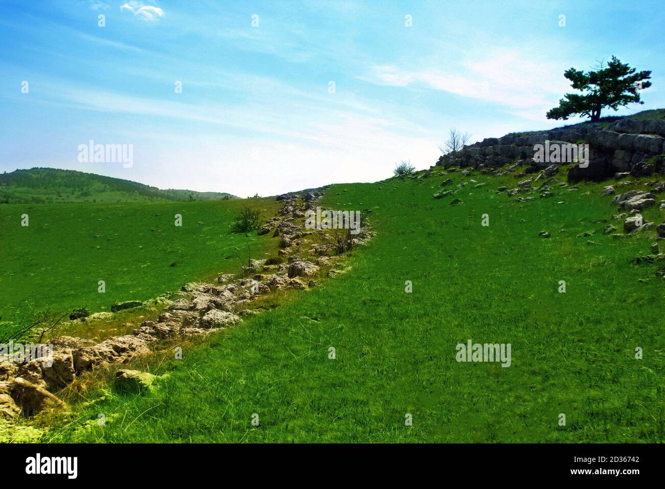 Mountain stone path leading to the top of the hill. The road for the ...