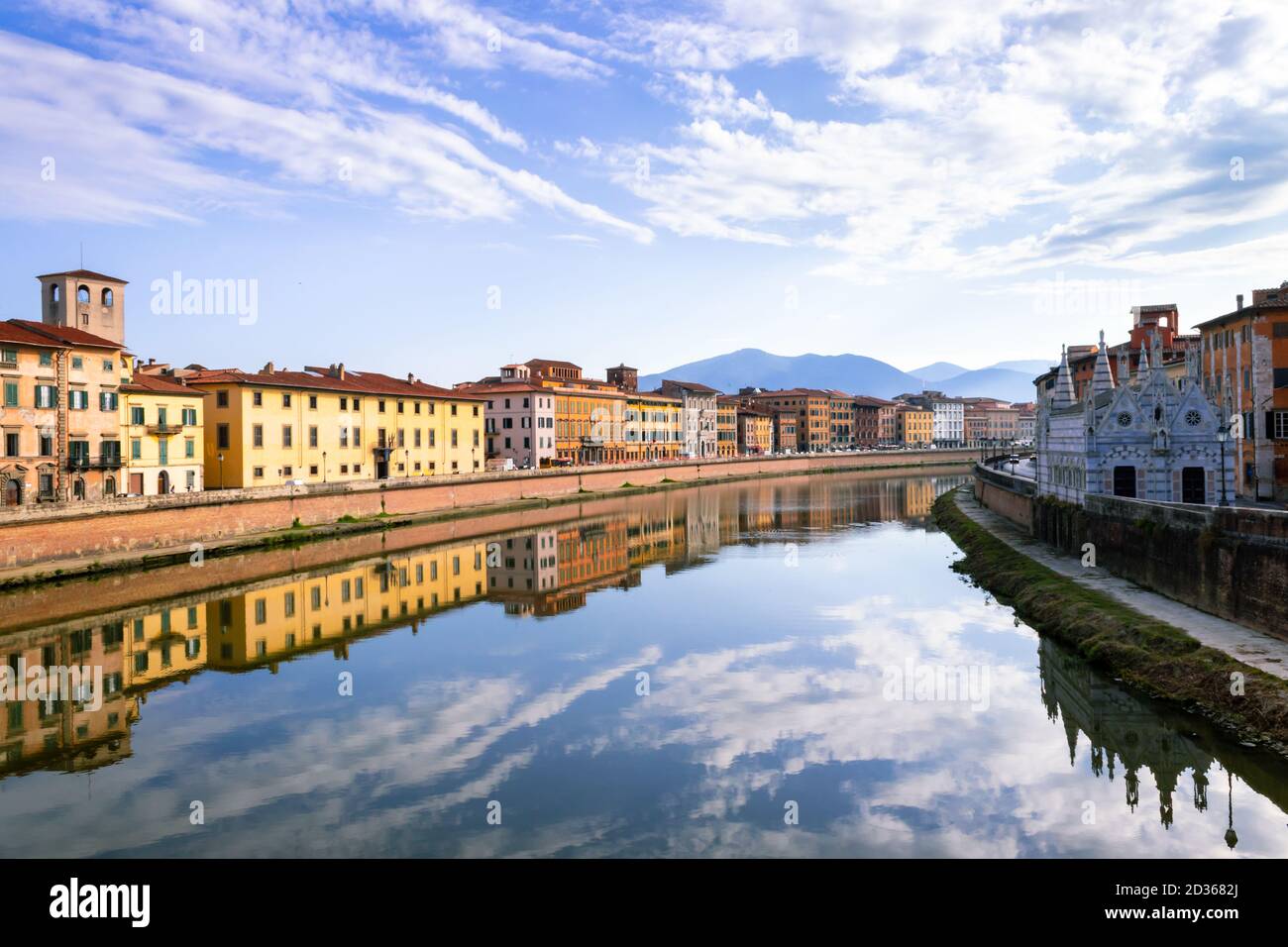 View of the river Arno lined with colorful buildings in the city of ...