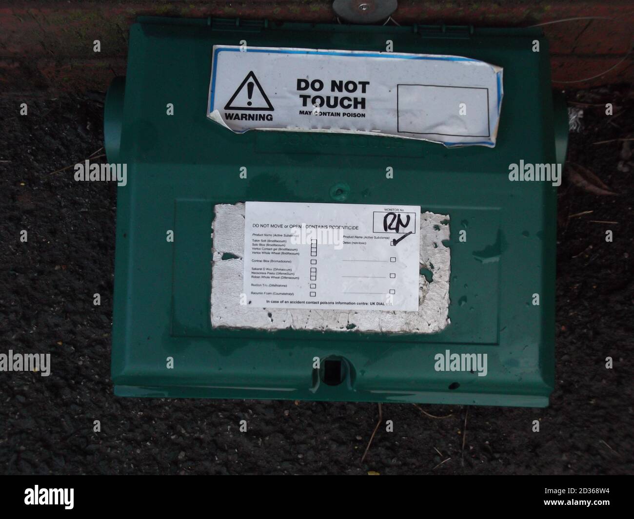 Green plastic rat poison box, rat bait station Stock Photo - Alamy