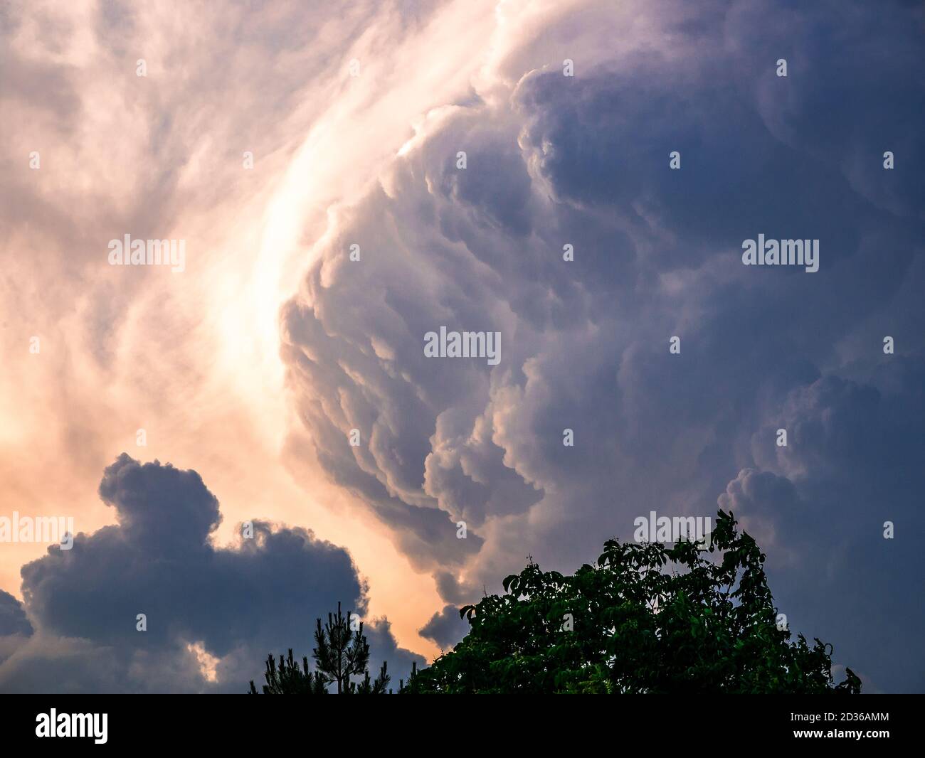 The edge of the massive supercell illuminated by the sun, before it ...