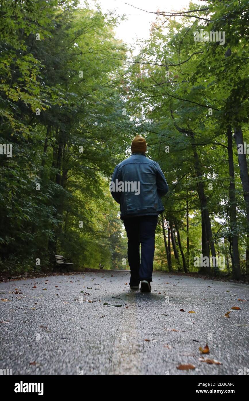Man walking on wet path - Springbank Park London Ontairo Canada - Photo ...