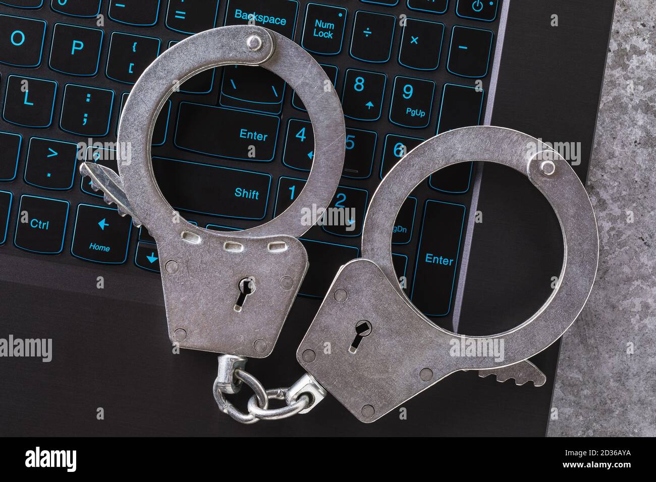 Computer keyboard and handcuffs top view. Criminal concept Stock Photo ...