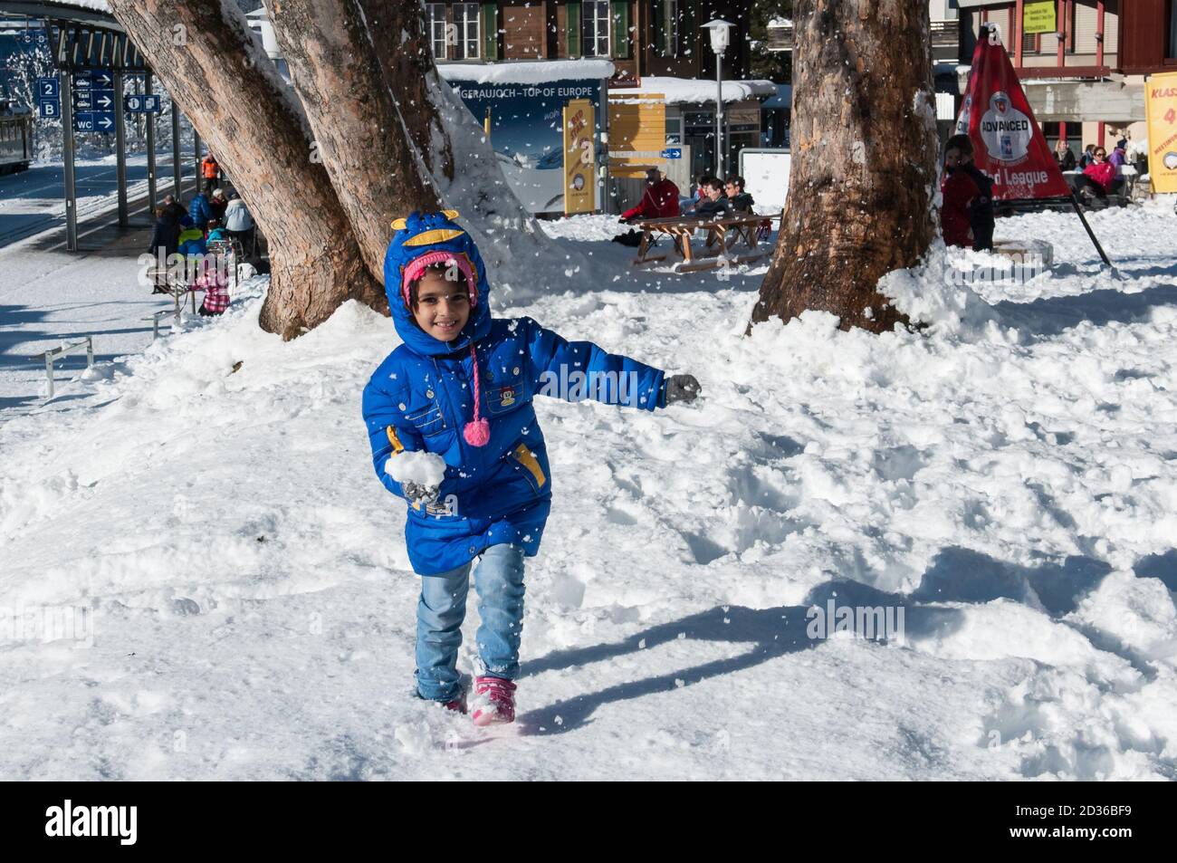 Happy Indian family playing with fresh white snow in Switzerland Shimla ...