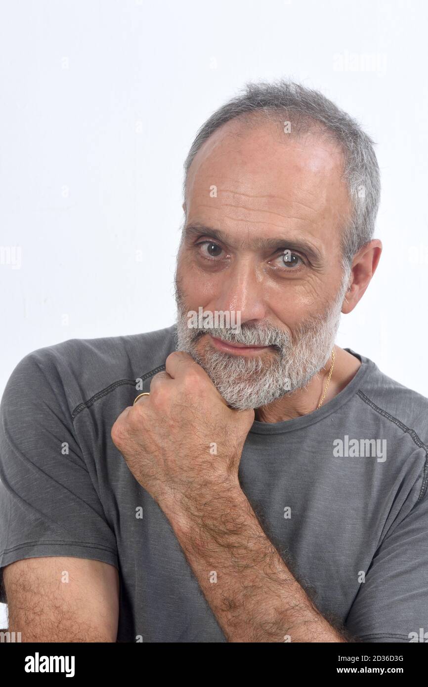 portrait of middle aged man hand on face on white Stock Photo - Alamy