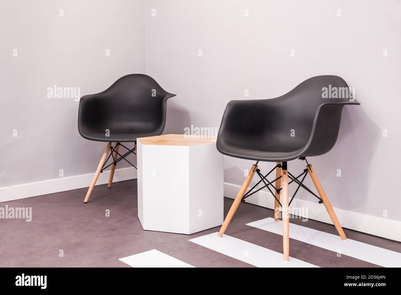 Closeup shot of chairs and a small table in a room Stock Photo - Alamy