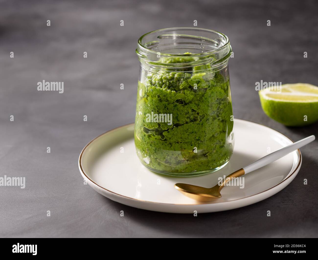 italian green pesto sauce in a glass jar Stock Photo - Alamy