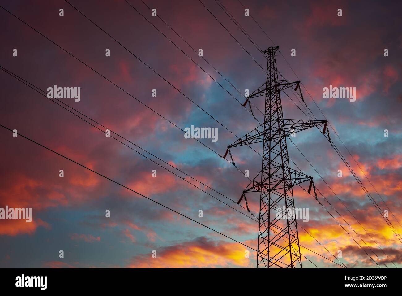 Transmission tower, power tower on dramatic colorful sky background ...