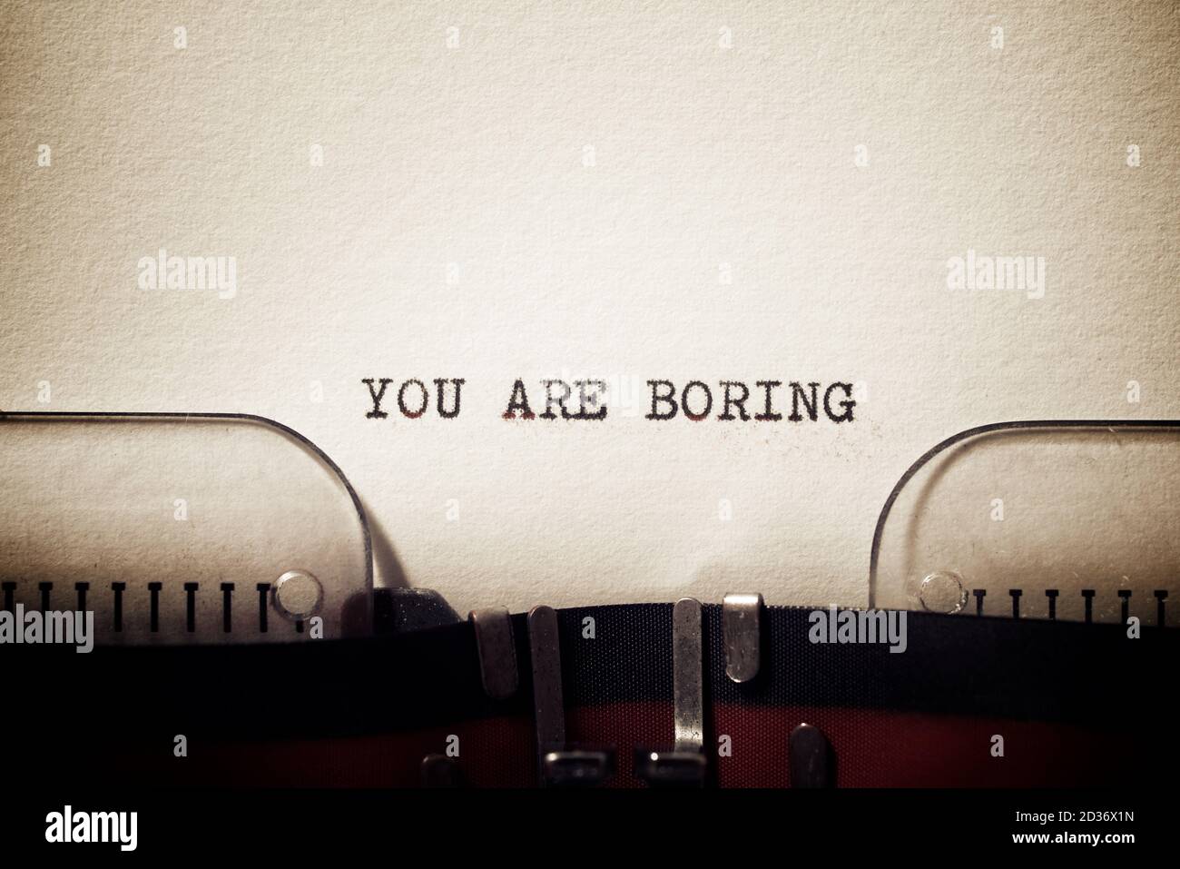 You are boring phrase written with a typewriter Stock Photo - Alamy