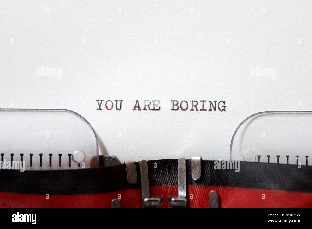 You are boring phrase written with a typewriter Stock Photo - Alamy