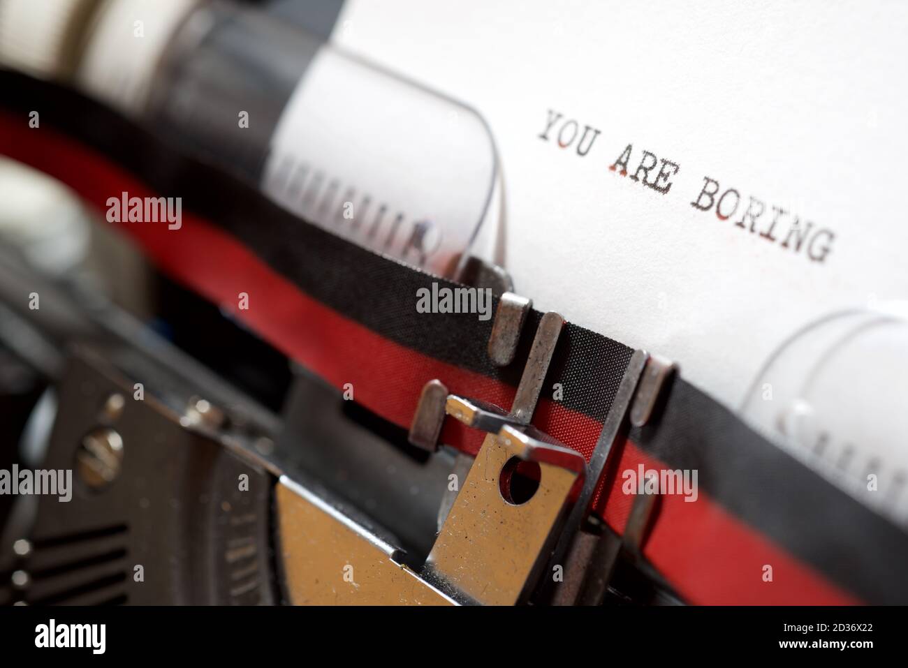 You are boring phrase written with a typewriter Stock Photo - Alamy