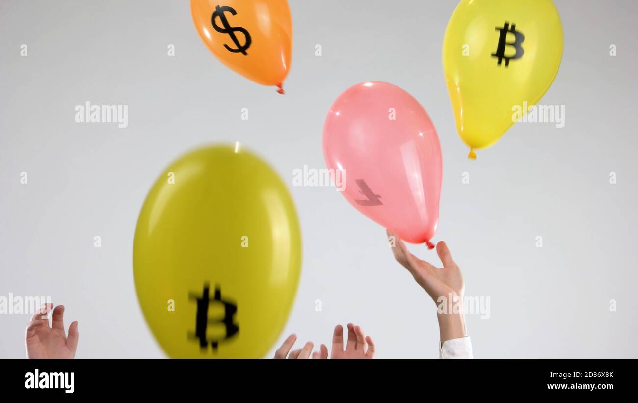 Colored balloons with currency signs Stock Photo - Alamy