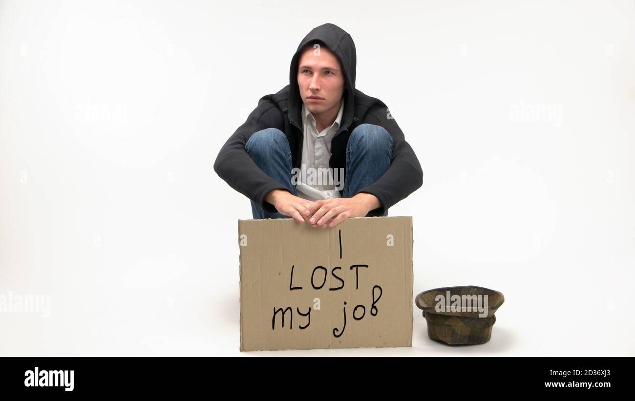 Young jobless man with cardboard sign Stock Photo - Alamy