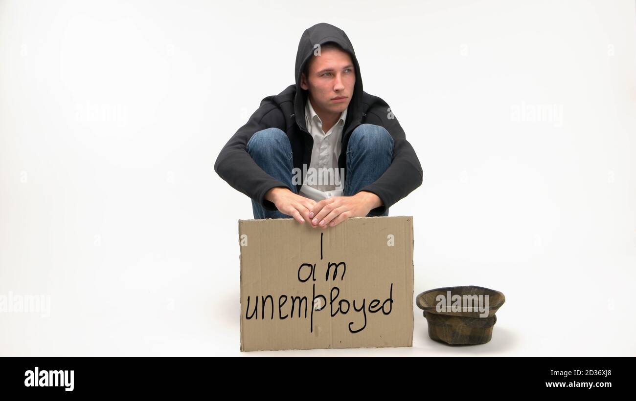 Sad young man lost his job and begs donations Stock Photo - Alamy