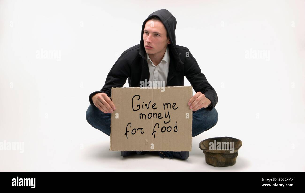 Man with cardboard sign asks money for food Stock Photo - Alamy