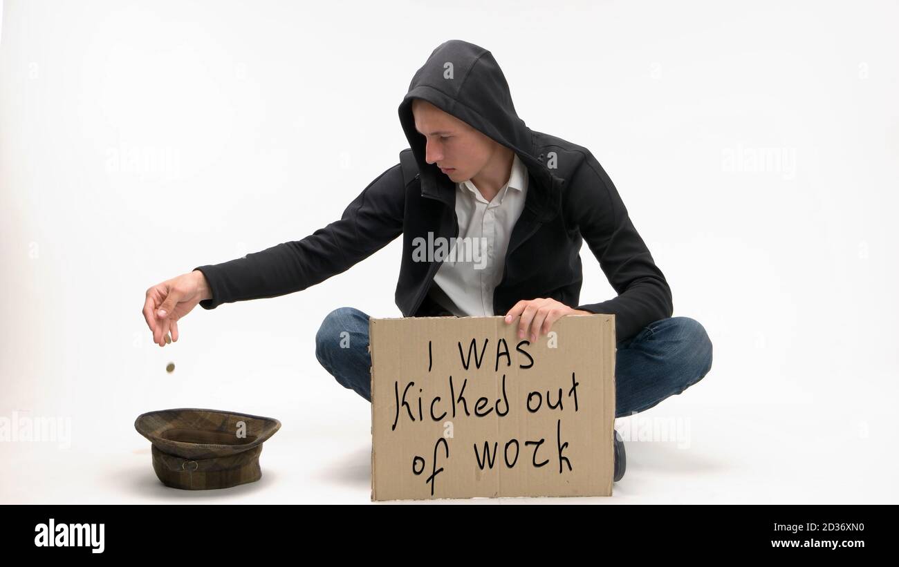 Man with cardboard sign I was kicked out of work Stock Photo - Alamy