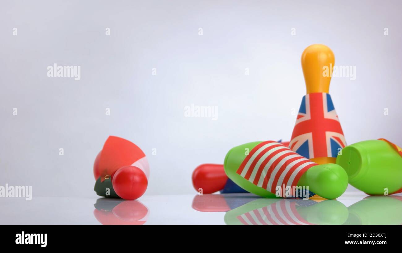 Fallen bowling pins on white background Stock Photo - Alamy