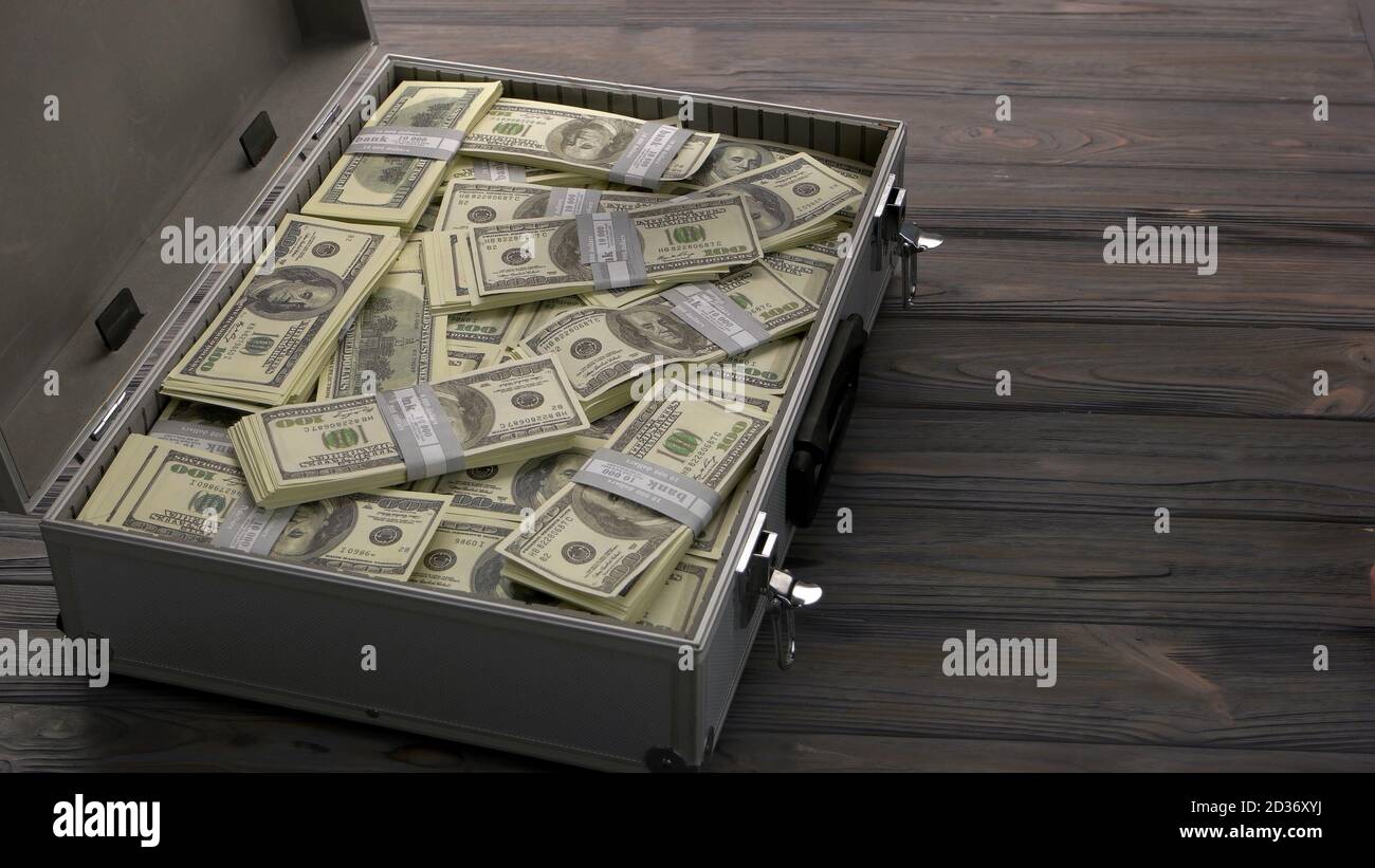Open silver briefcase full dollar hi-res stock photography and images ...