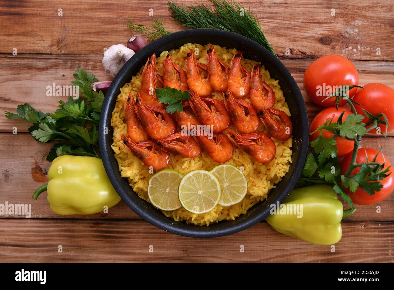 Rice paella with shrimp, saffron and olive oil - Spanish national dish ...