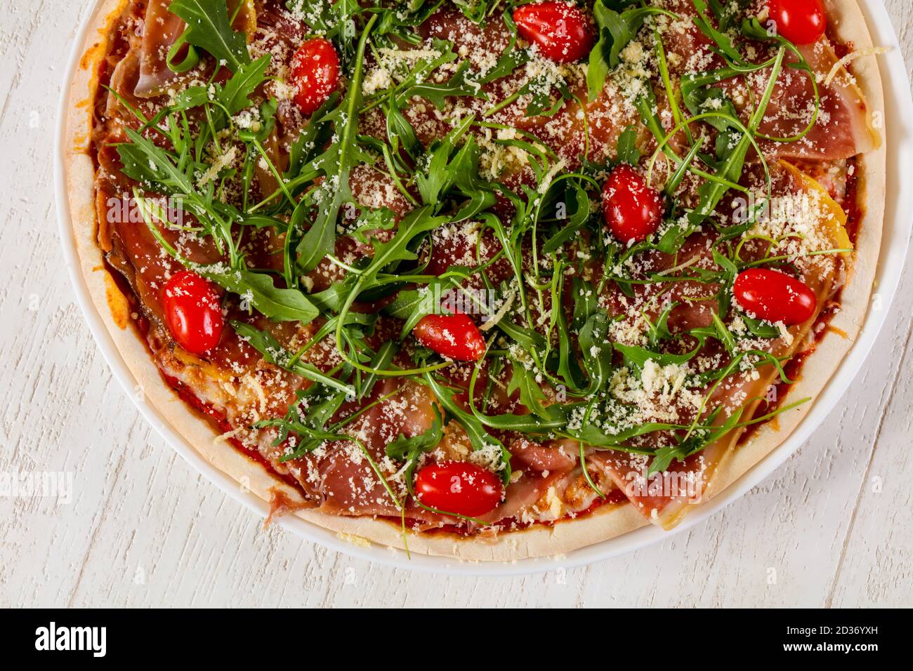 Pizza with hamon and ruccola Stock Photo - Alamy